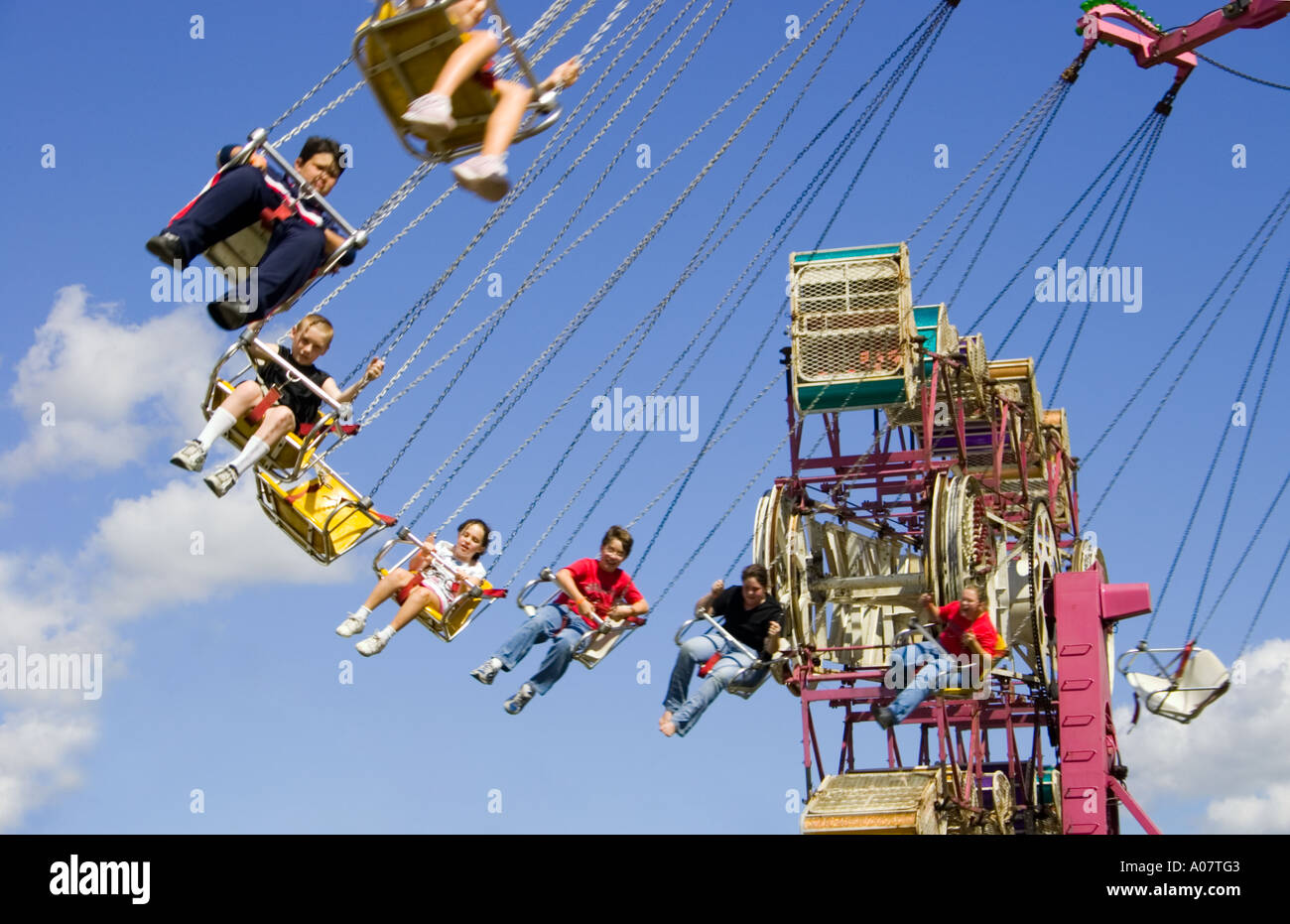 Swing carvinal amusement ride Stock Photo - Alamy