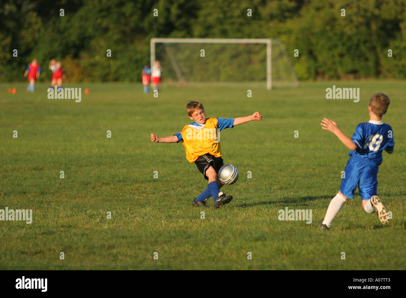 Boys playing soccer (football) in a youth league in the United States ...
