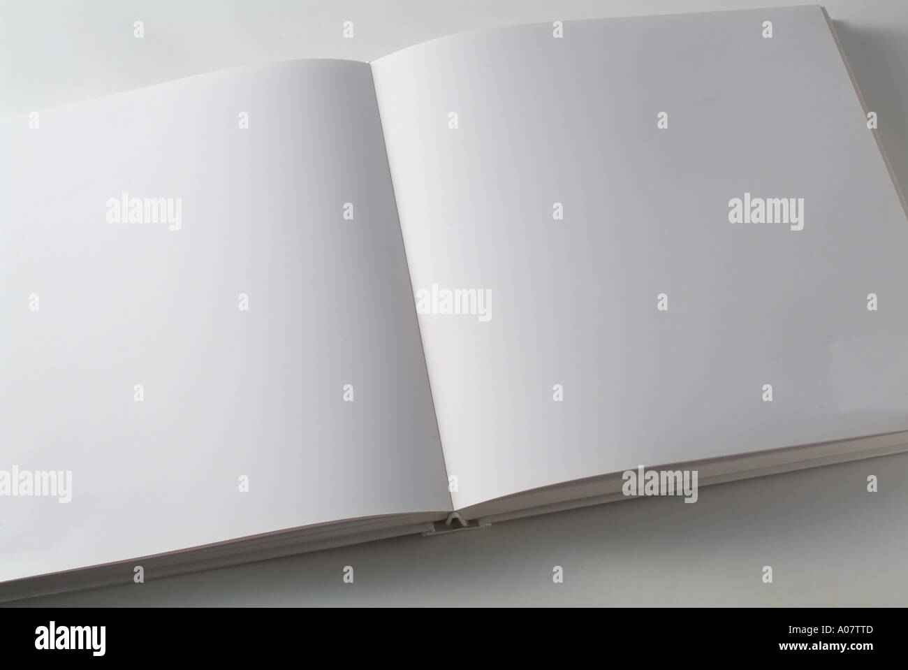 Book with white pages on white background Stock Photo - Alamy