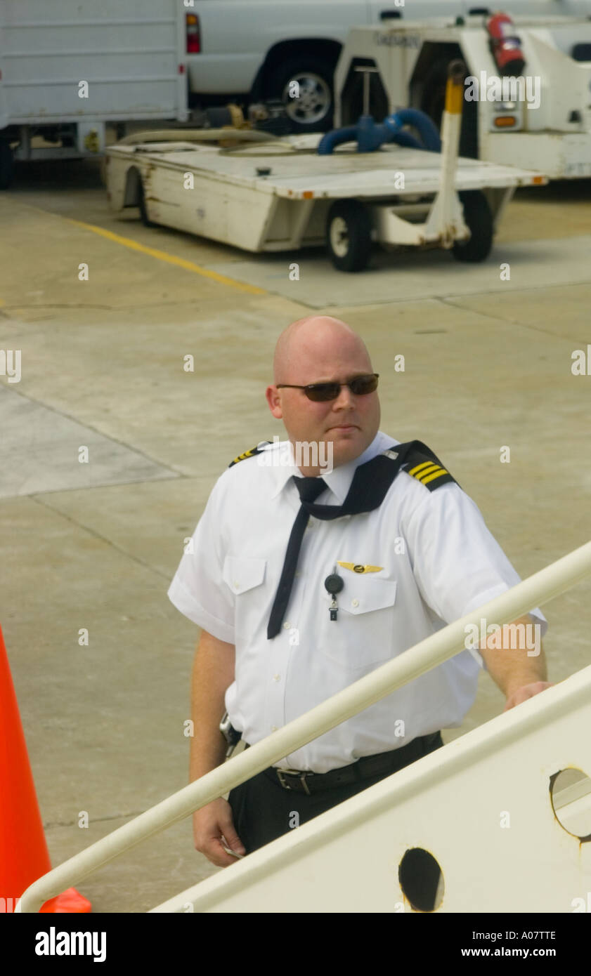 Airline pilot about to board small airplane Stock Photo - Alamy