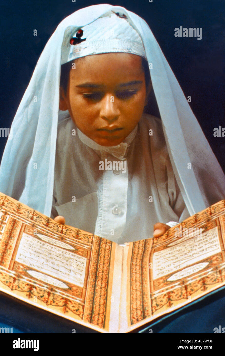 Boy reading the quran hi-res stock photography and images - Alamy