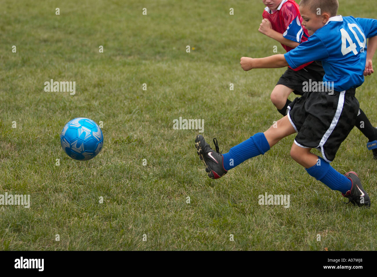 Boys playing soccer (football) in a youth league in the United States ...