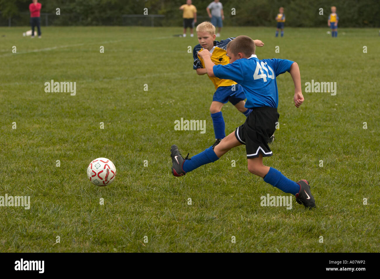 Boys playing soccer (football) in a youth league in the United States ...
