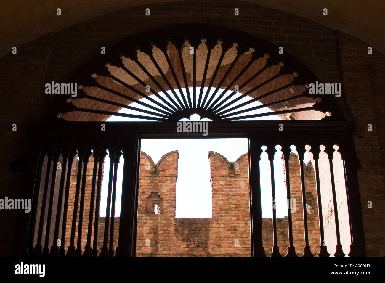 Medieval iron door with castle turret behind. Fontanellato, Parma ...
