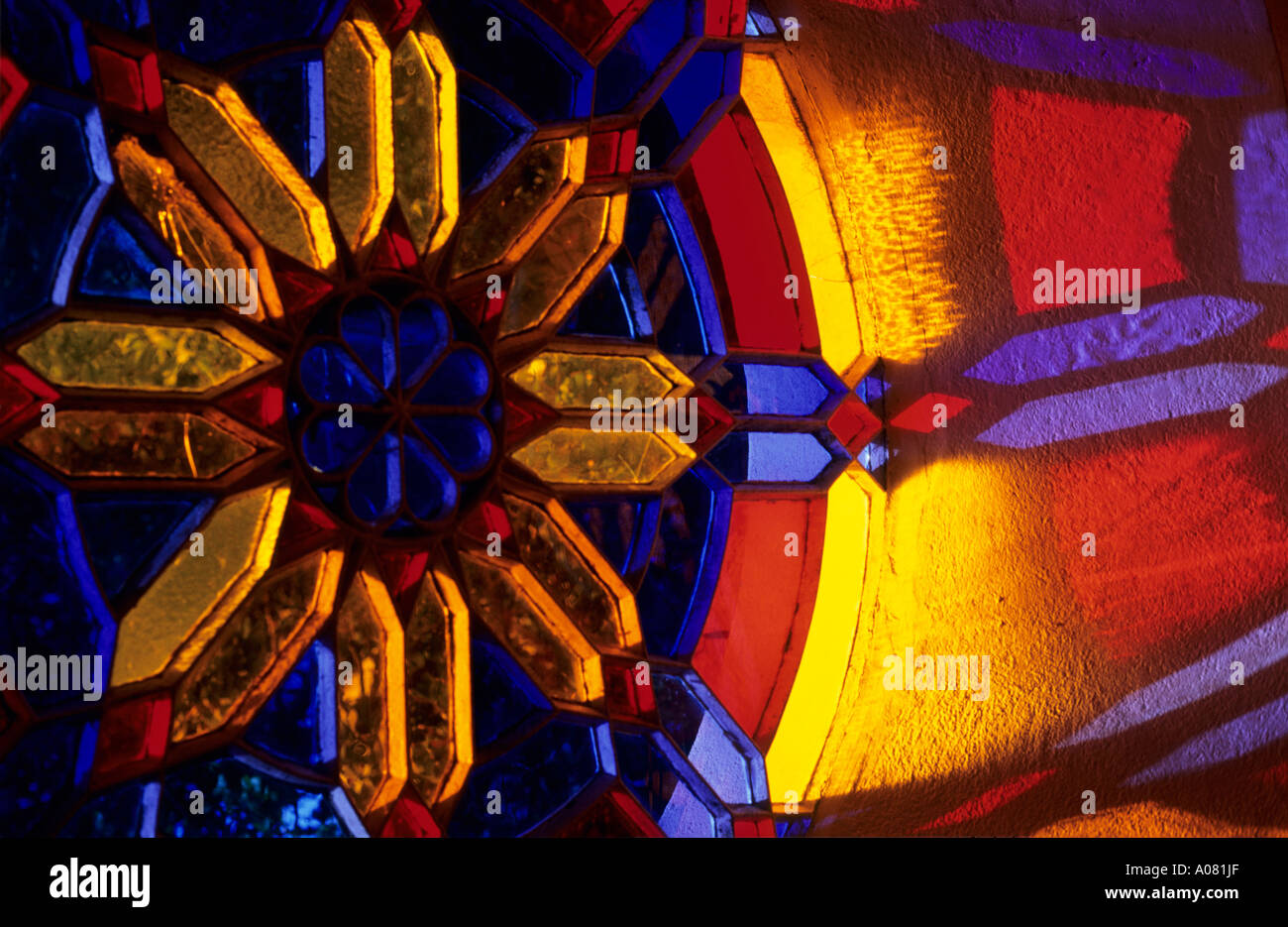 Section of stained glass with reflection on wall Stock Photo - Alamy