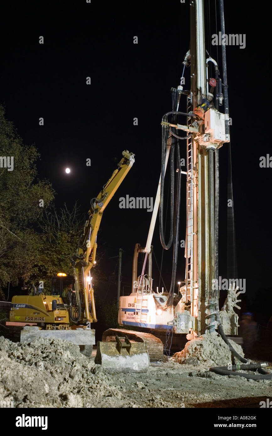 Piling foundations for road bridge at night Stock Photo - Alamy