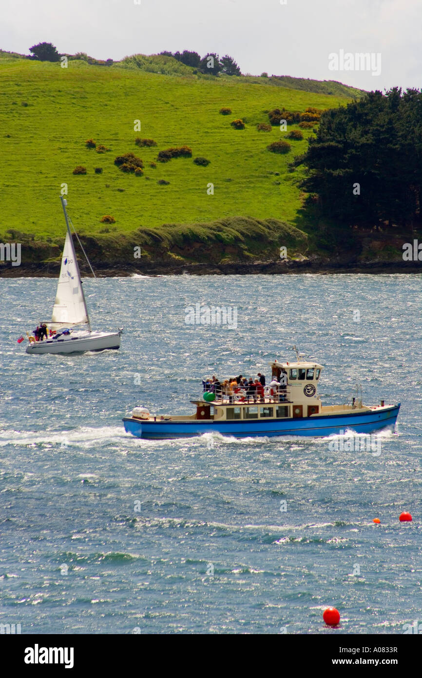 Passenger ferry to Falmouth passes St Anthony Head and sailing dinghy ...