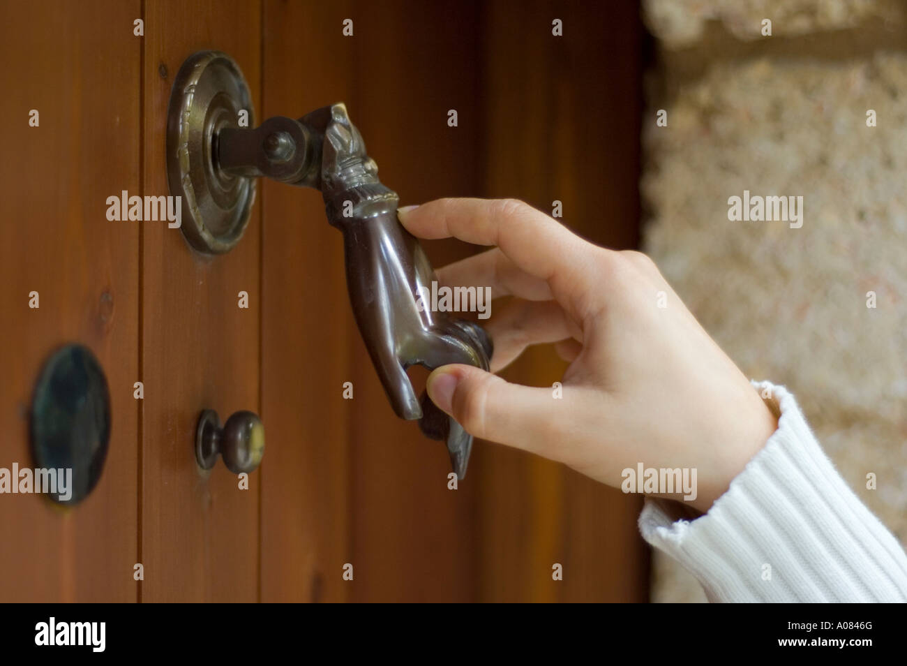 Hand with doorknob Stock Photo - Alamy