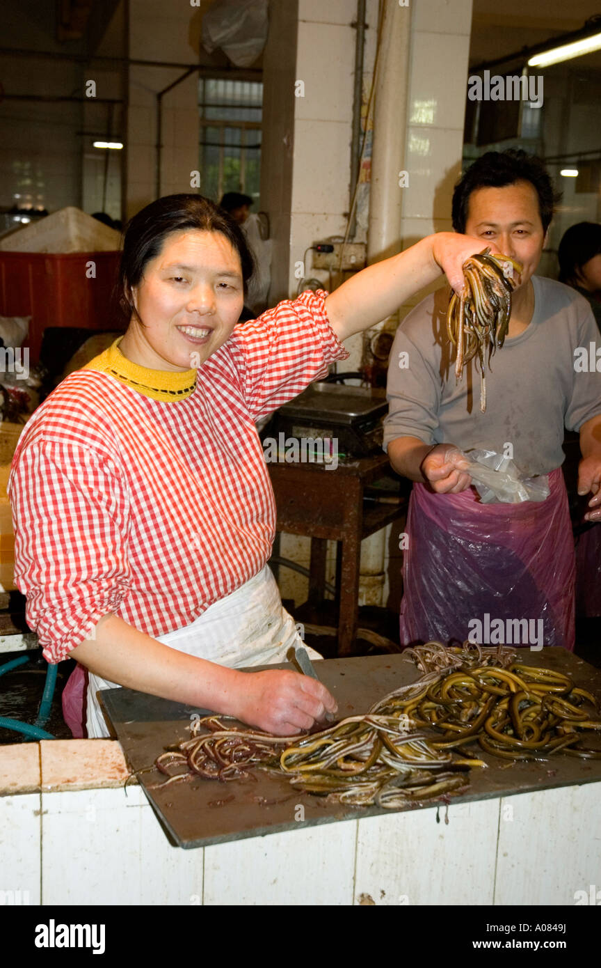 Friendly Chinese Female Eel Seller displaying her wares in Suzhou ...