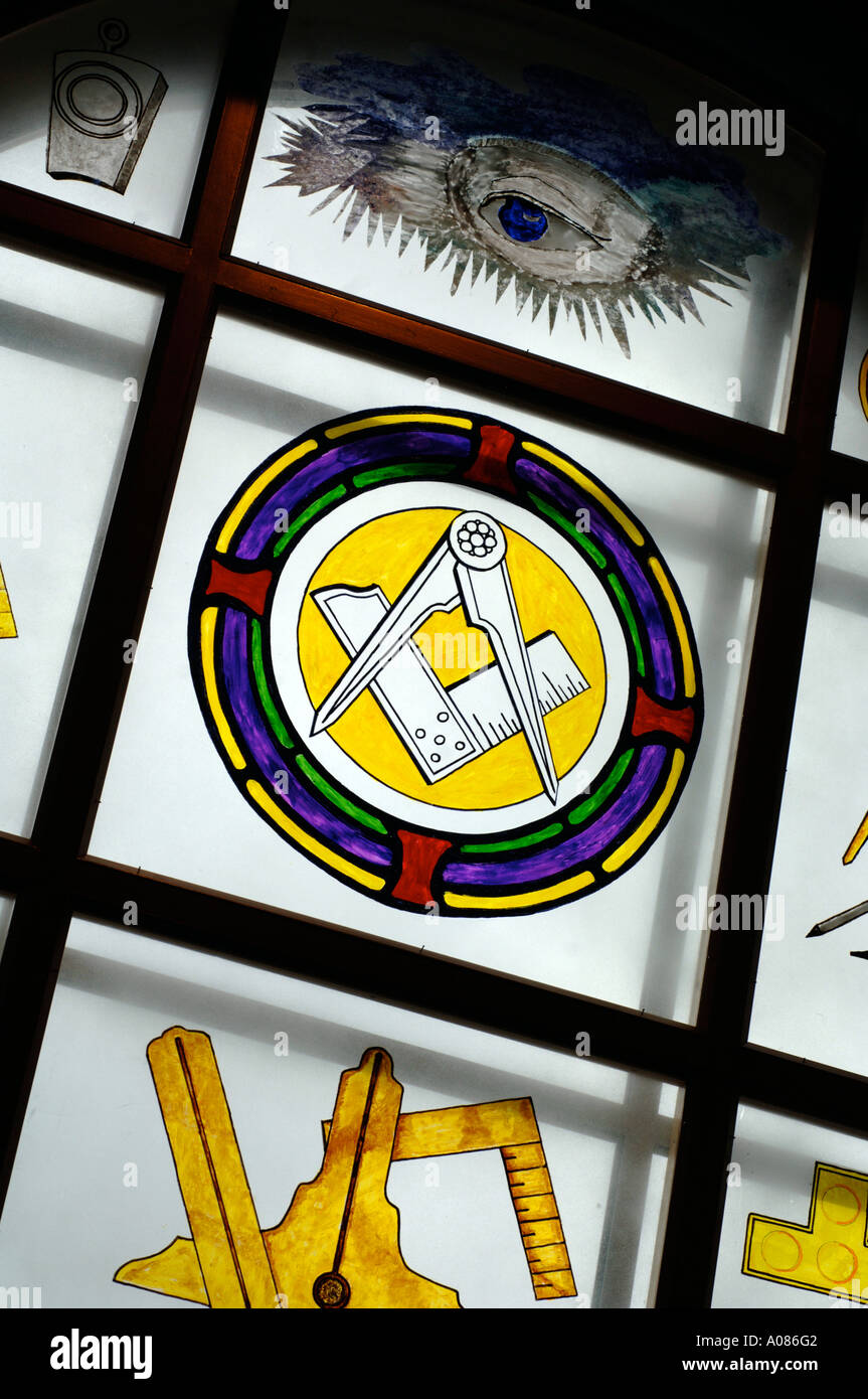 Close up of a plate glass window showing masonic symbols in a ...