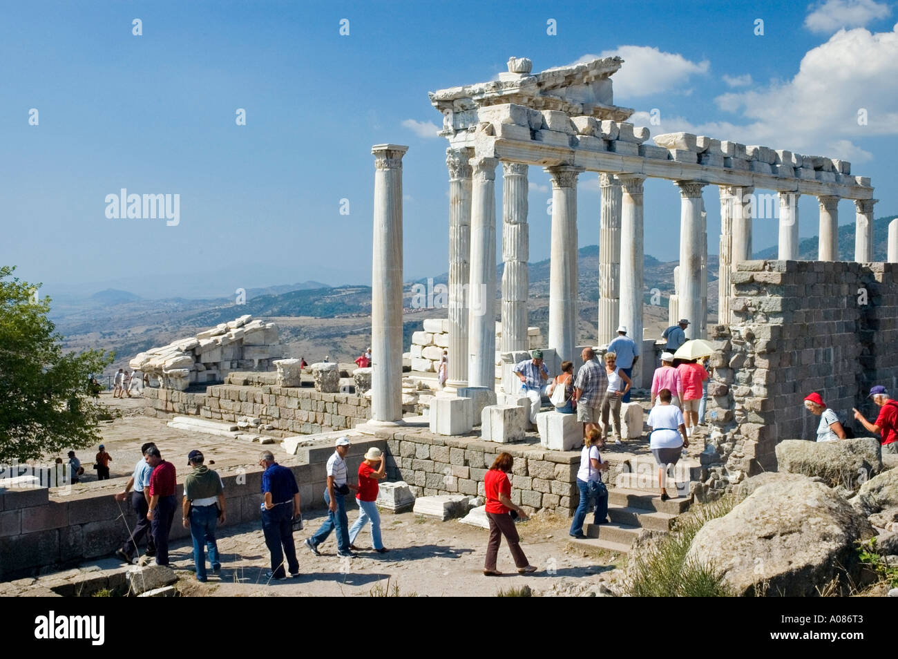 Tourists and columns, Temple of emperor Trajan, the Acropolis, Bergama ...