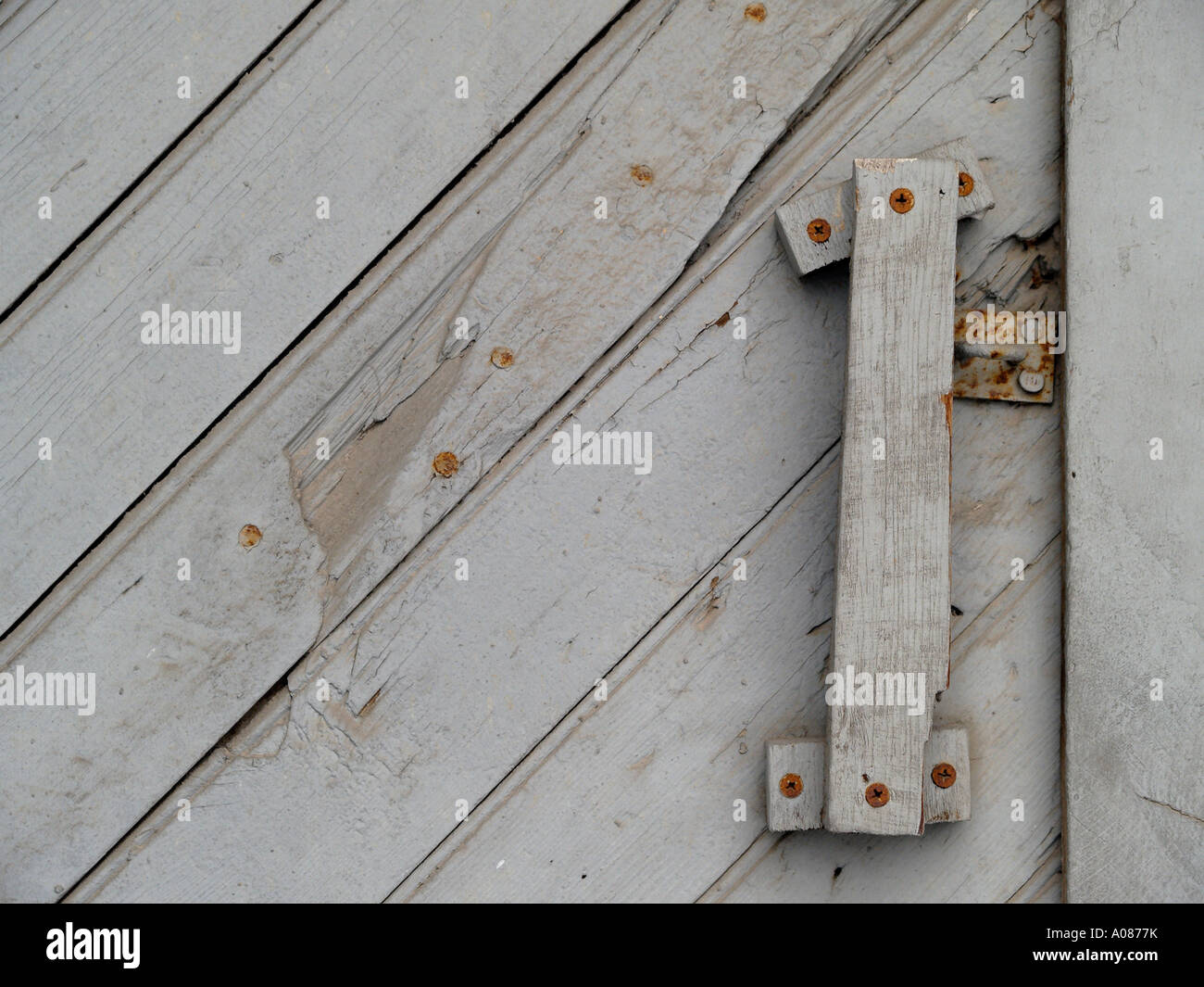 Detail of an old wooden receiving door in an alley behind a downtown ...