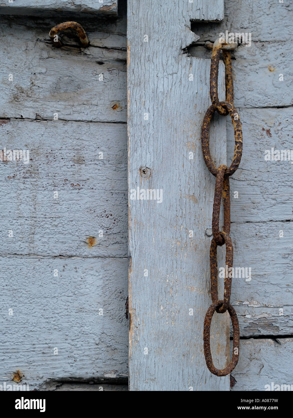 Detail of an old wooden receiving door in an alley behind a downtown ...