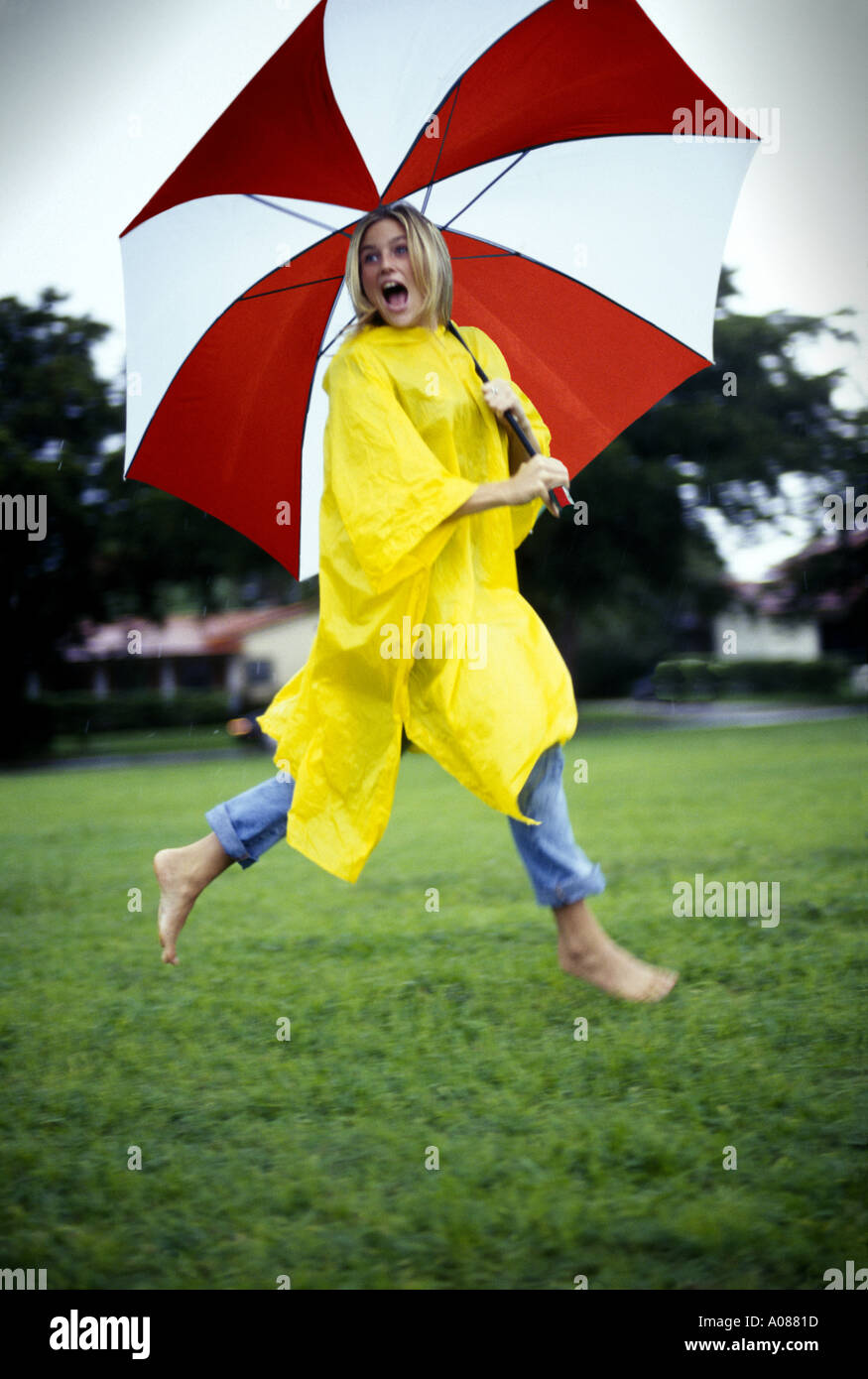 Girl running in the rain Stock Photo - Alamy