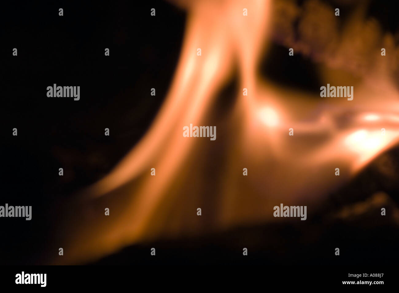 Dancing light of flames from a log wood fire Stock Photo - Alamy