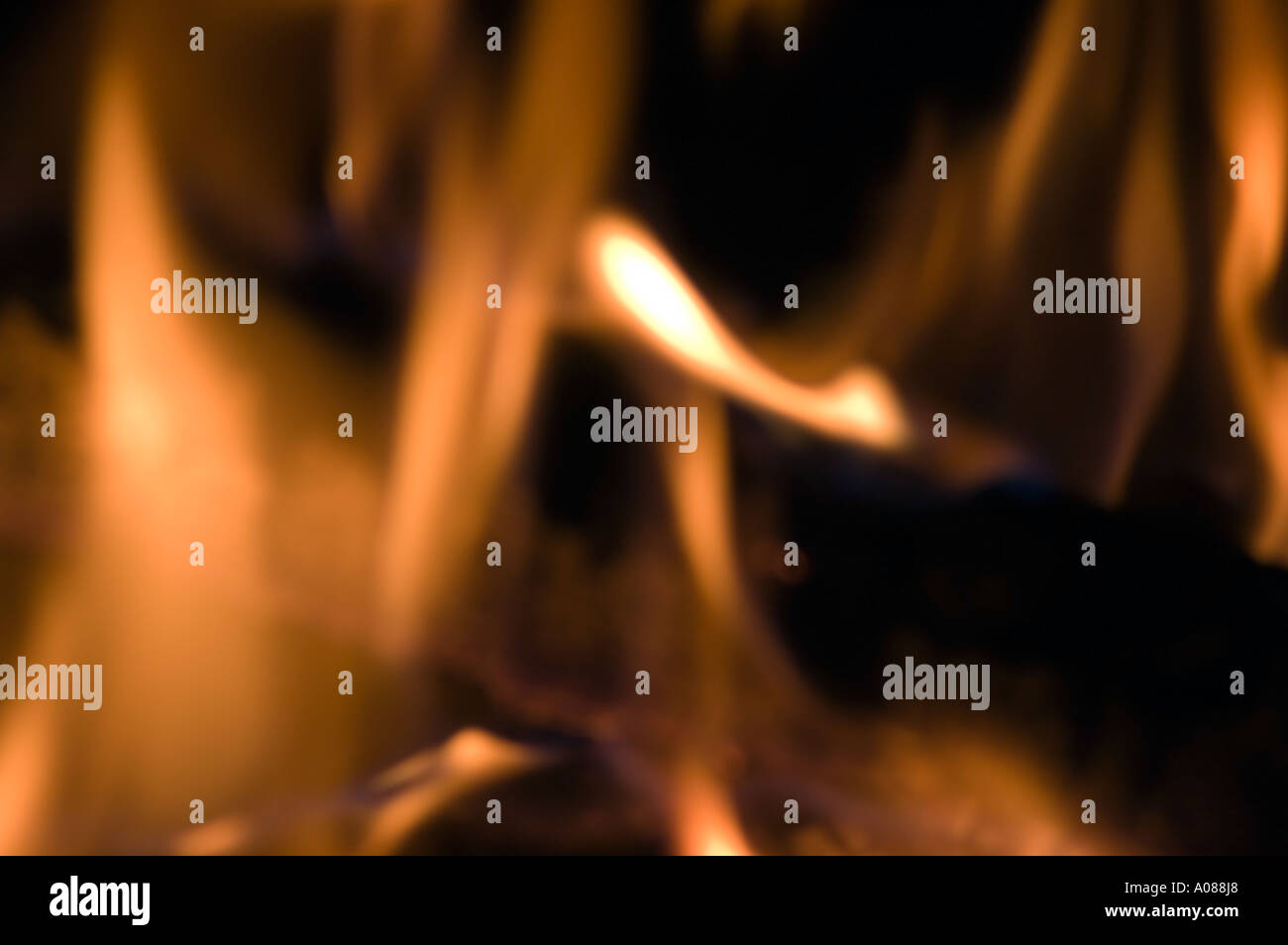 Dancing light of flames from a log wood fire Stock Photo - Alamy