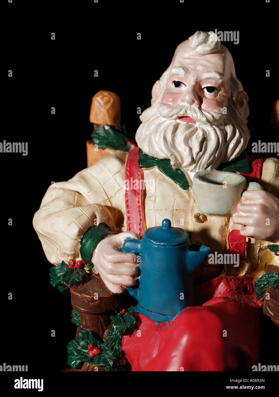 Christmas decoration depicting Santa relaxing with coffee after a long ...