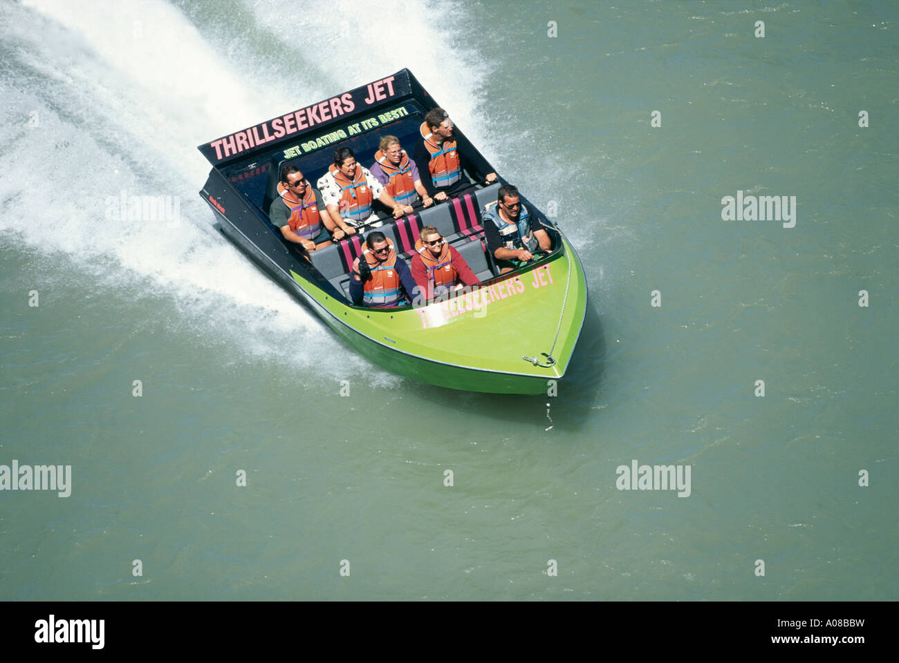 A group of passengers well secured in a jet boat as they enjoy the ...