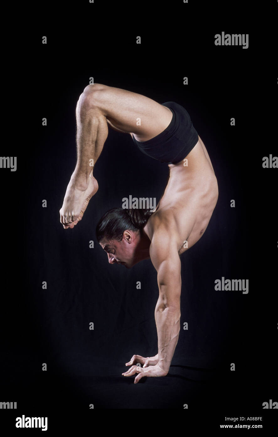 gymnast balancing on his hands Stock Photo - Alamy