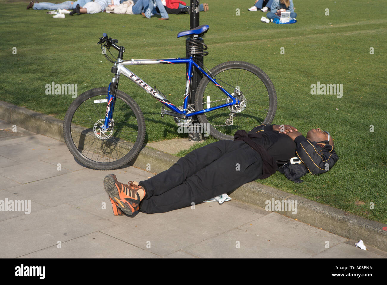Man resting next to his bicycle on London's South Bank Stock Photo - Alamy