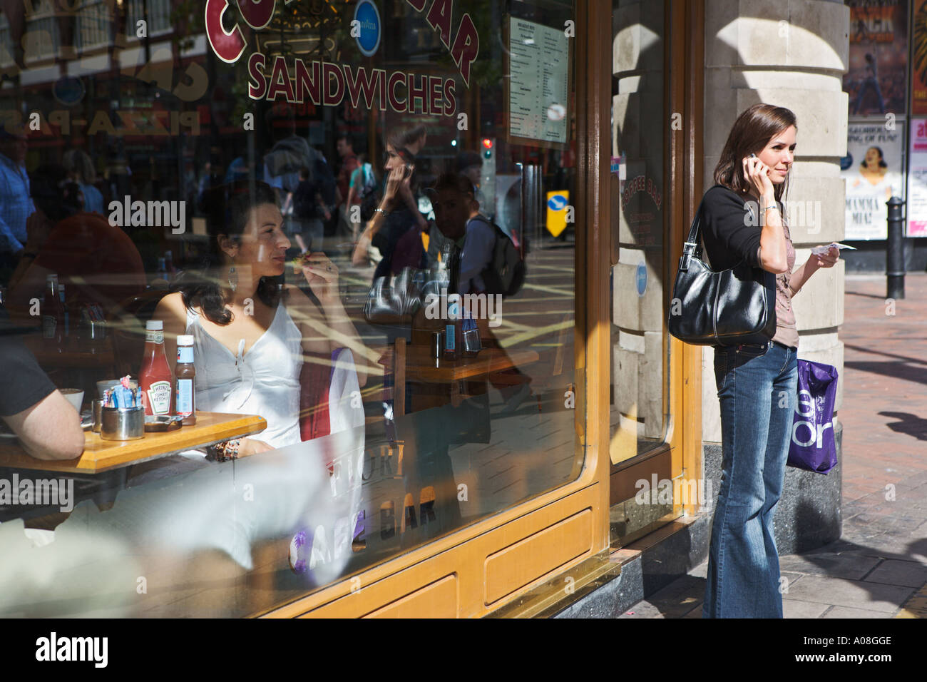 Woman smoking outside street cafe hi-res stock photography and images ...