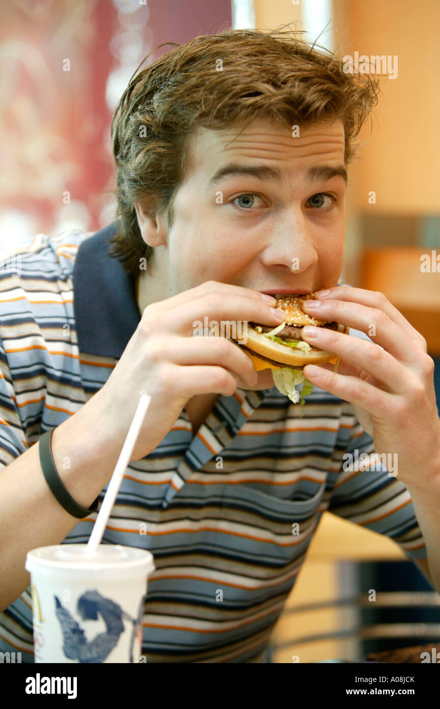 Young adult humans eating hi-res stock photography and images - Alamy