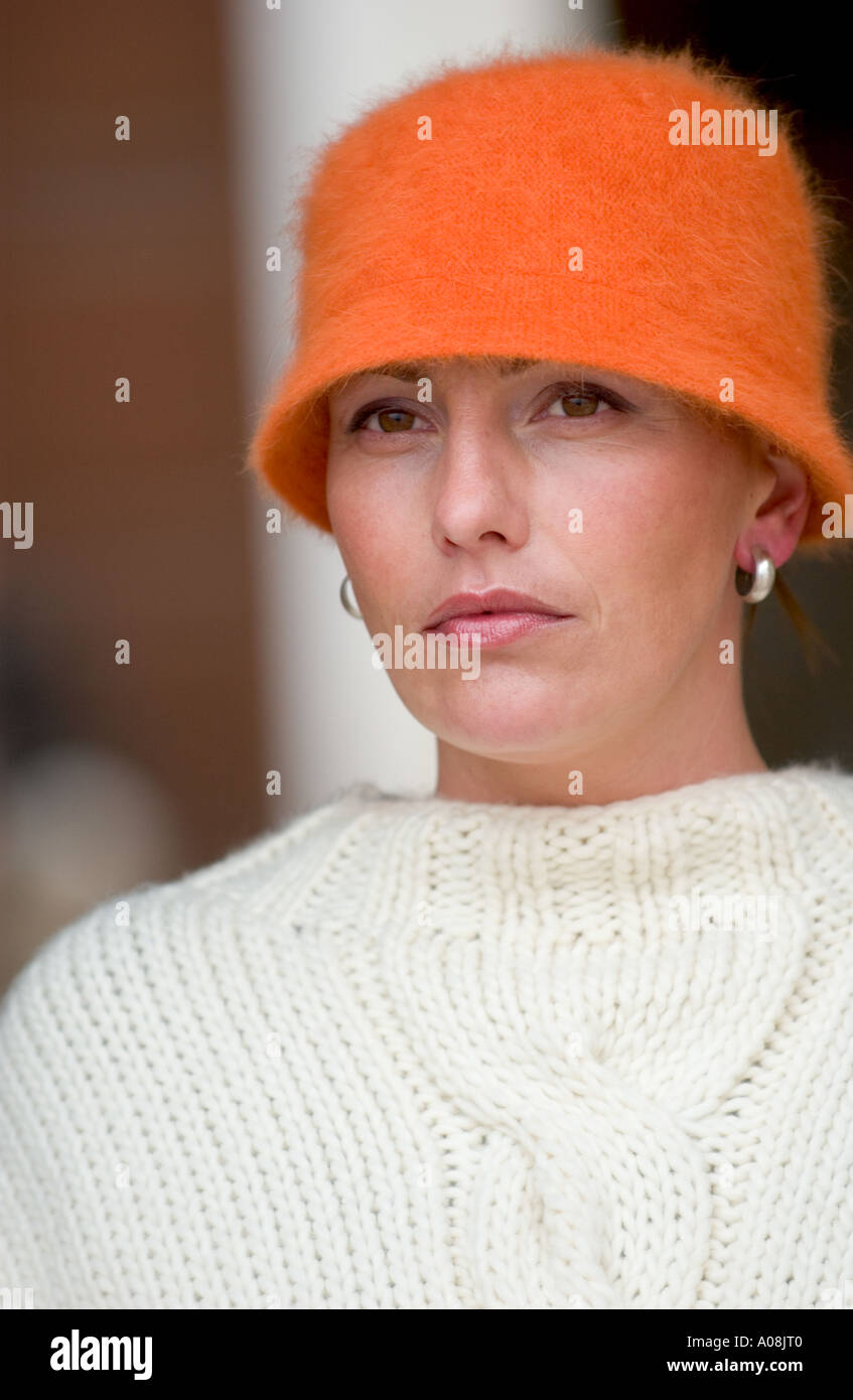 pretty young woman wearing orange hat Stock Photo - Alamy