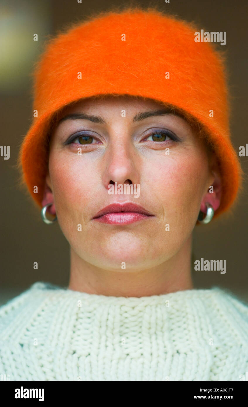 pretty woman wearing orange hat Stock Photo - Alamy