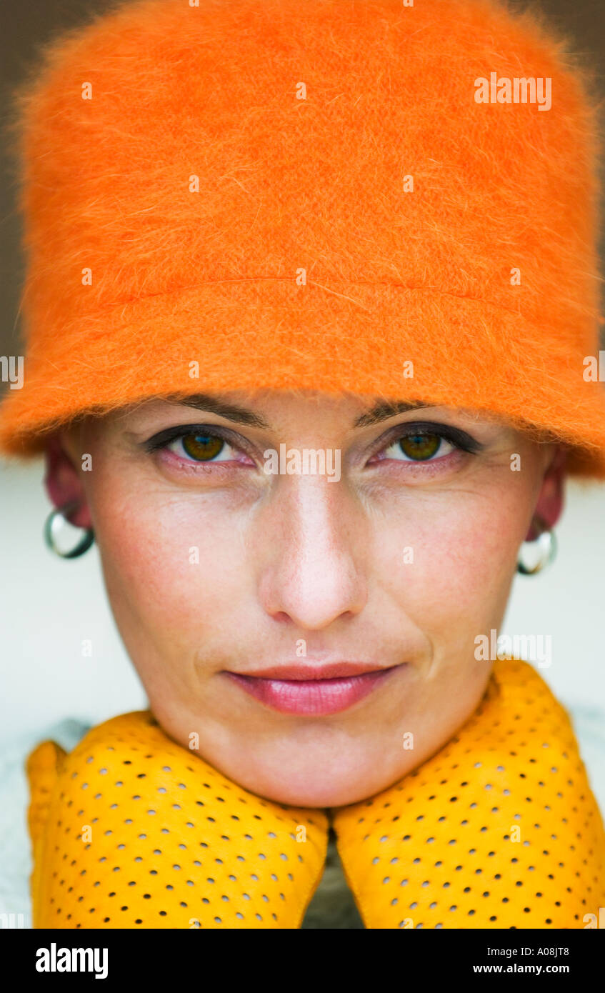 pretty woman wearing orange hat Stock Photo - Alamy