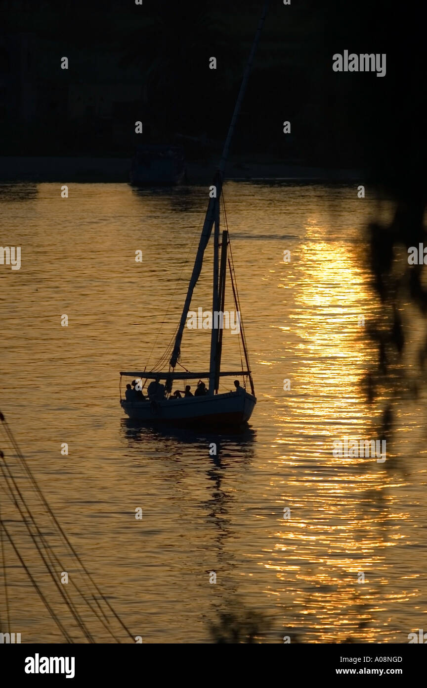A felucca, the traditional Nile boat on the Nile river at sunset, Luxor ...