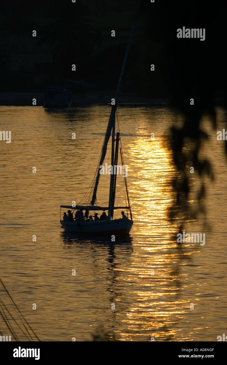 A felucca, the traditional Nile boat on the Nile river at sunset, Luxor ...