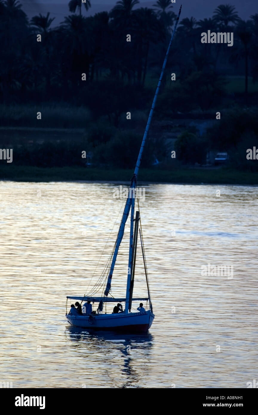A felucca, the traditional Nile boat on the Nile river at sunset, Luxor ...