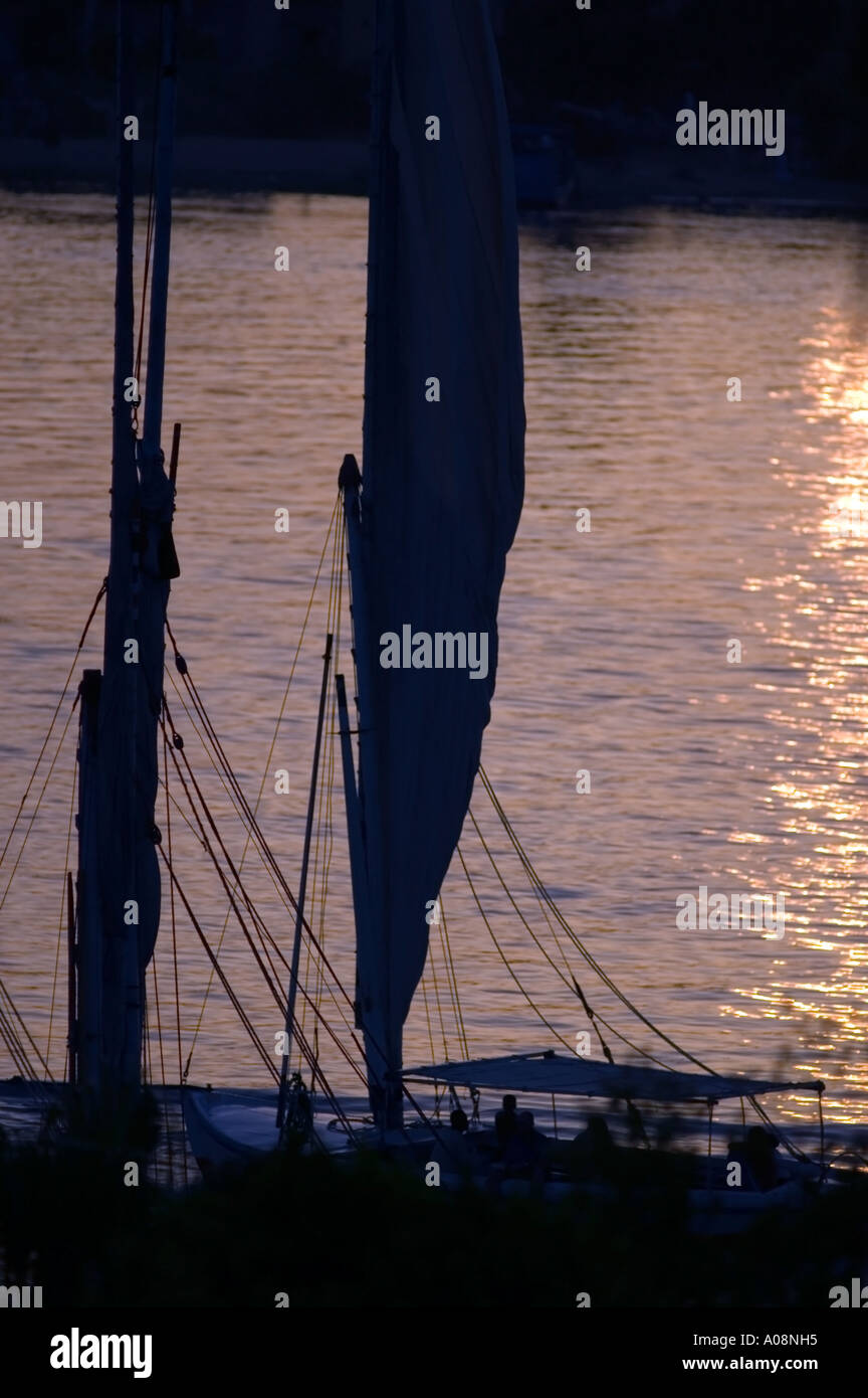 A felucca, the traditional Nile boat on the Nile river at sunset, Luxor ...