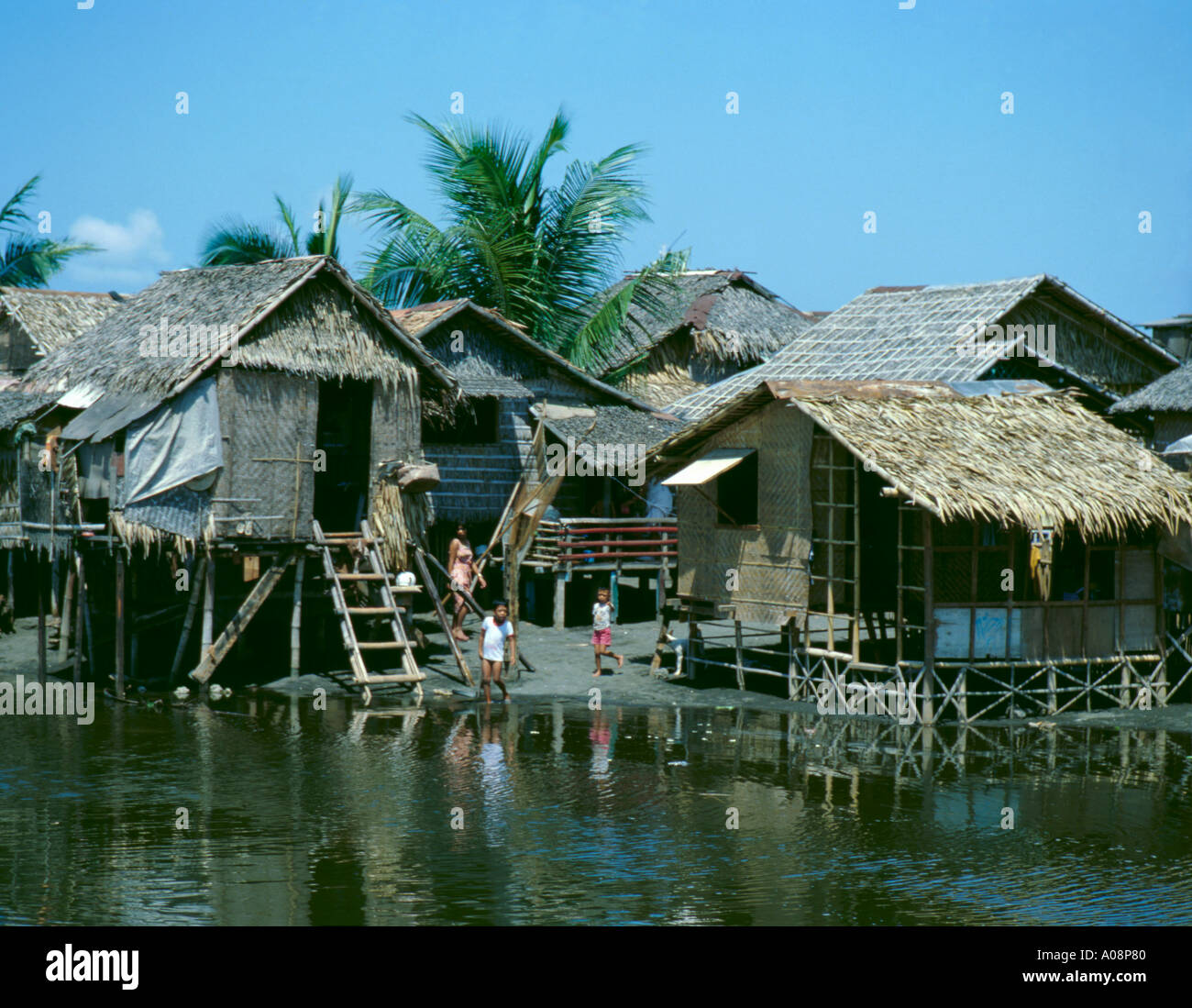 Timber huts built on stilts, Port of Batangas, south of Manila, mid ...