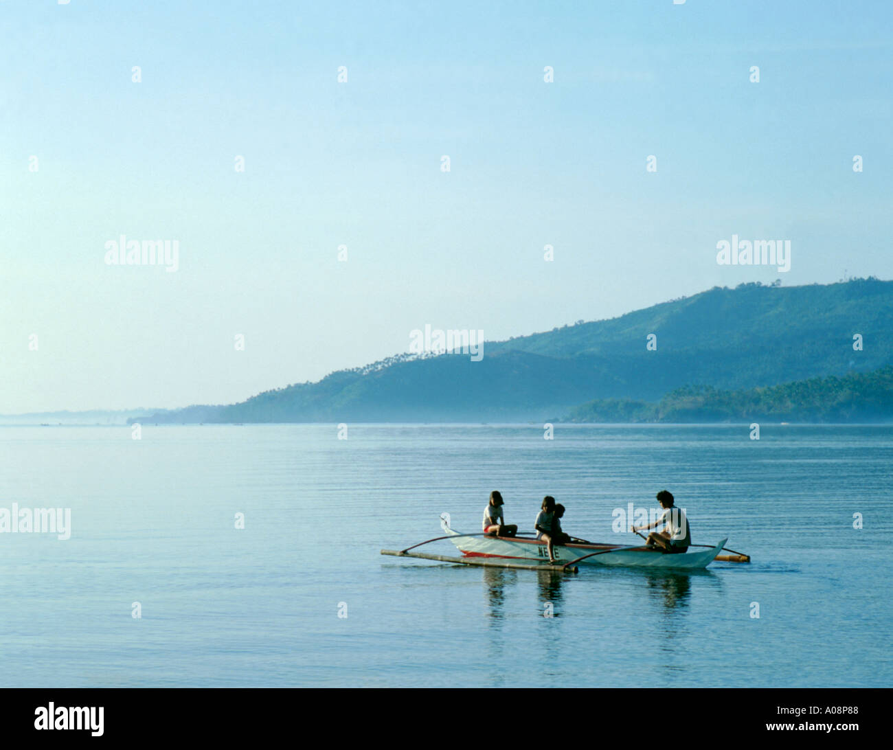 Filipino children in an outrigger canoe, Philippines, Asia Stock Photo ...