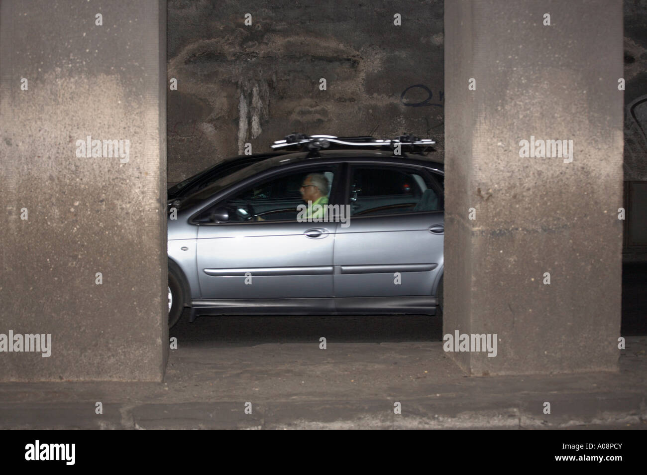 Cars driving under a bridge in Gdynia Stock Photo - Alamy