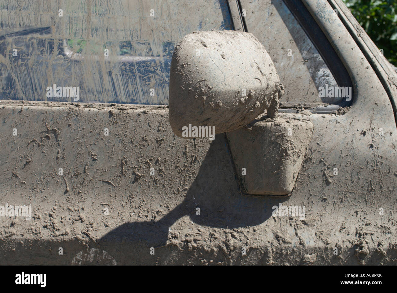 A muddy four wheeled drive flatbed truck on a farm in Europe Stock ...