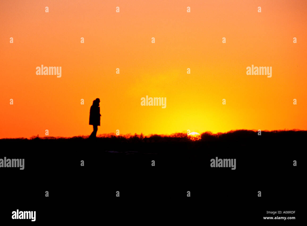 Romantic couple looking distance sunset hi-res stock photography and ...