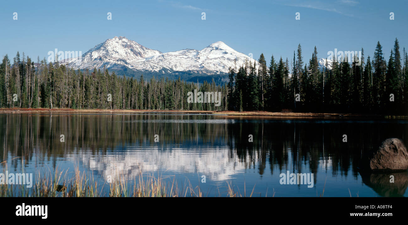 Scott Lake in Oregon reflecting the snowcovered crests of North and ...