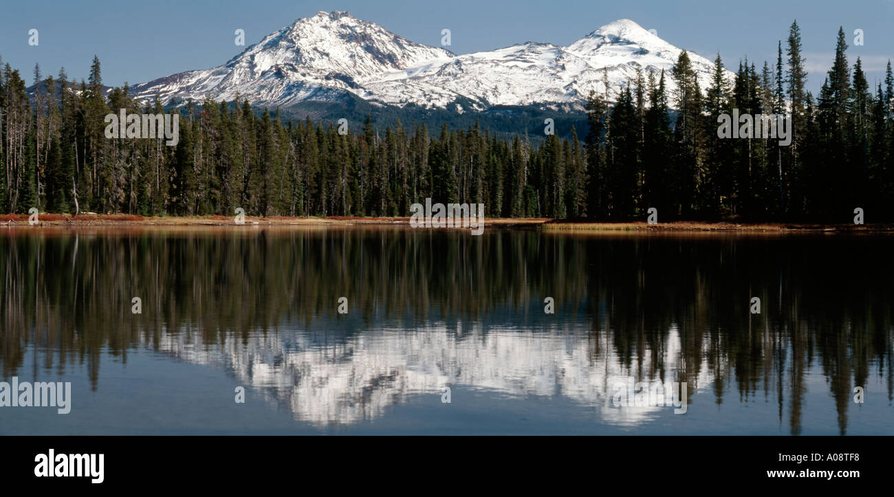 Scott Lake in Oregon reflecting the snowcovered crests of North and ...