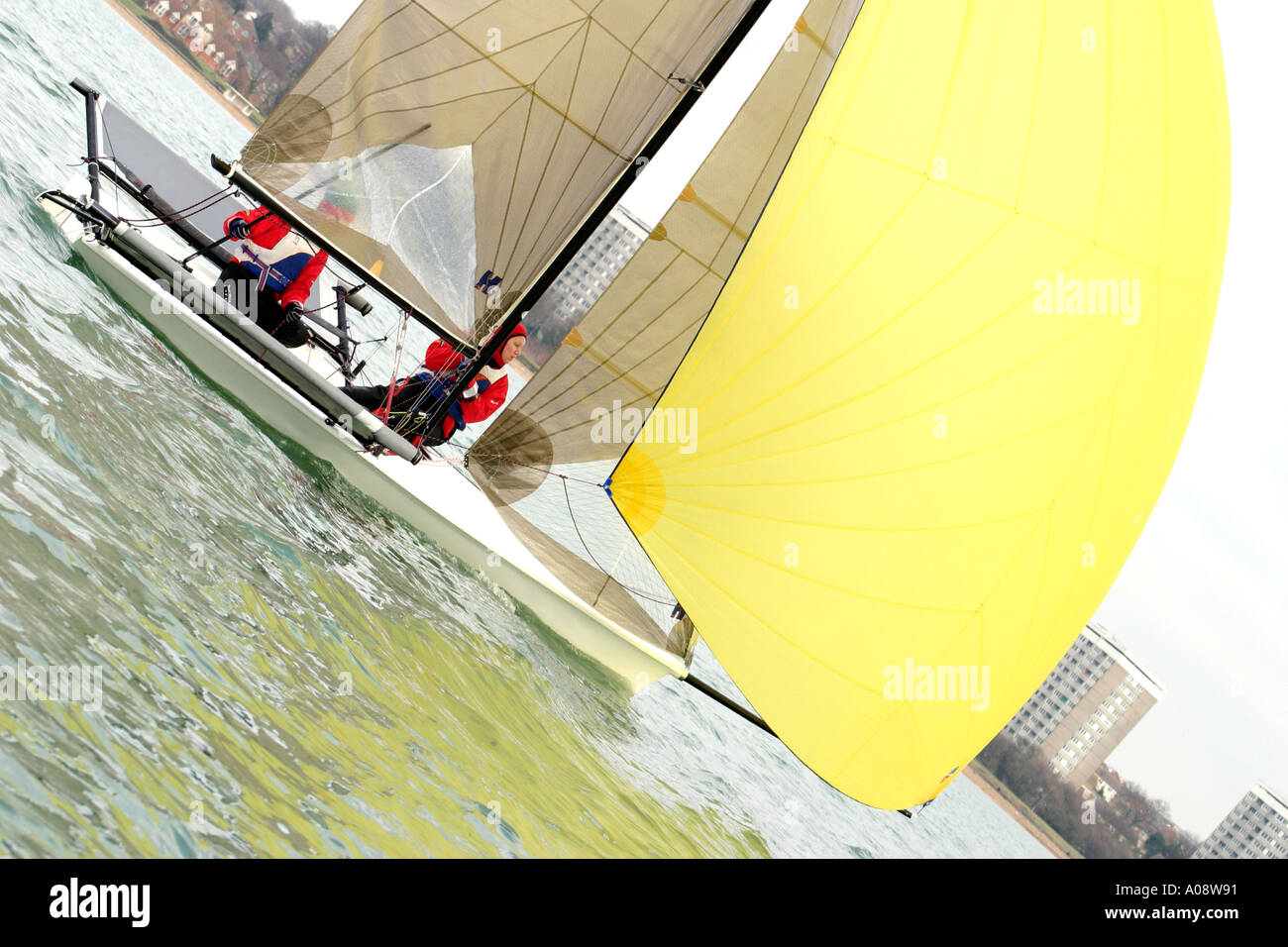 Boat with Yellow Sail Stock Photo - Alamy