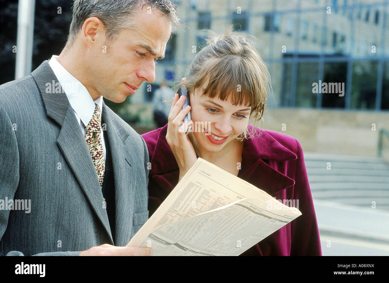 Young professionals reading the papers Stock Photo - Alamy