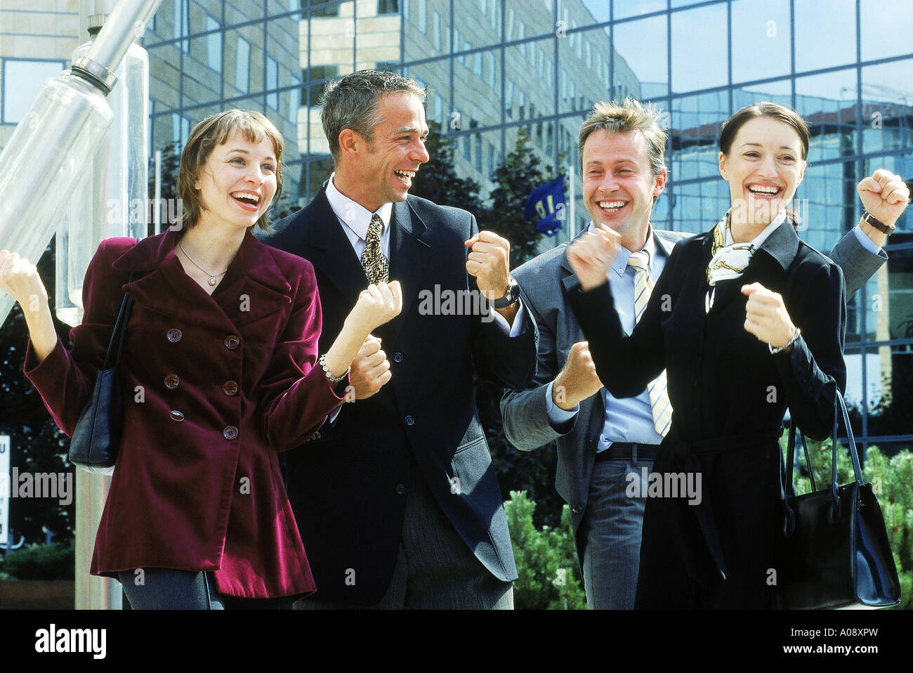 Young professionals cheering with happiness Stock Photo - Alamy