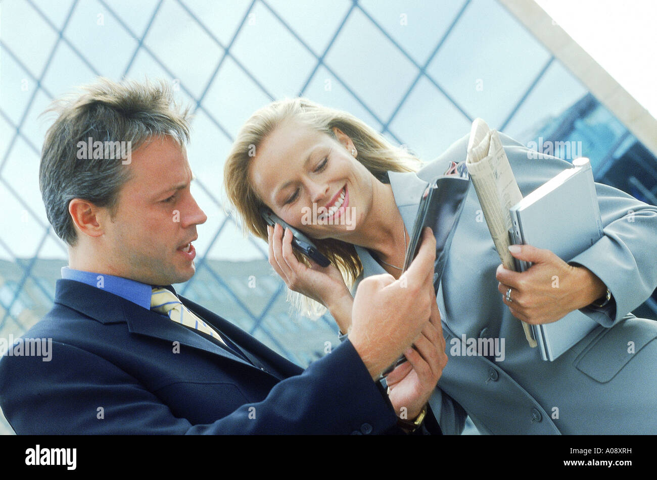 Young professionals reading a magazine together Stock Photo - Alamy