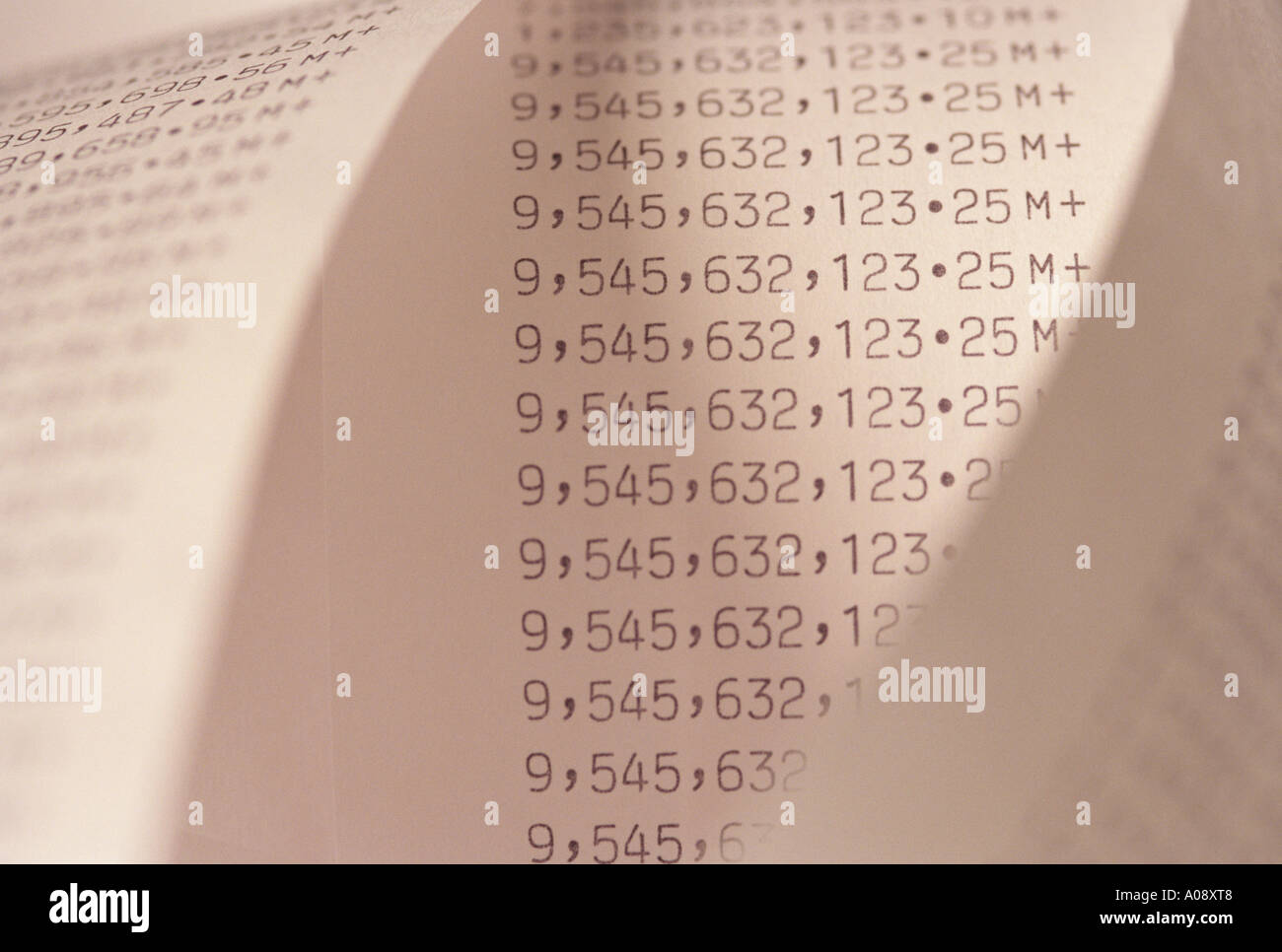 Adding machine tape abstract spiraling endless rows of large numbers ...