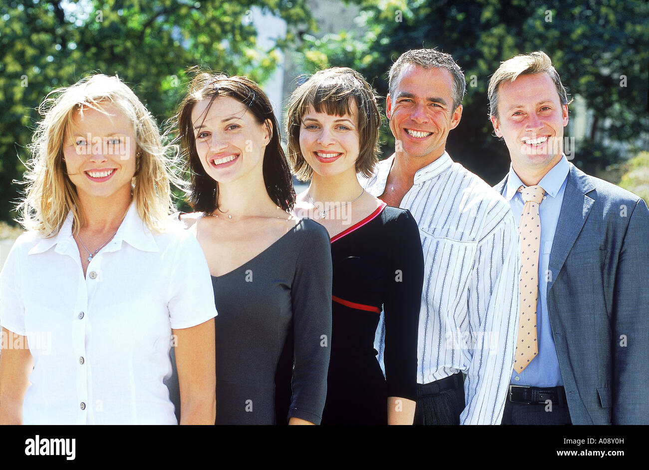 Portrait of business executives standing one behind the other Stock ...