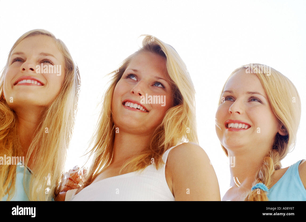 Three women standing together Stock Photo - Alamy