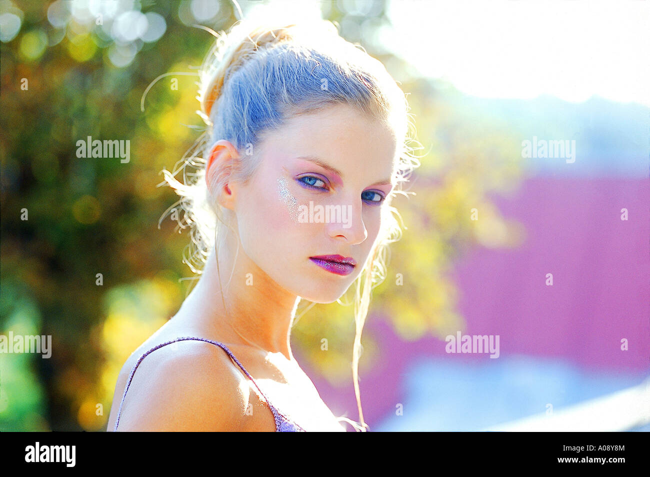 Side profile of a young woman wearing make up Stock Photo - Alamy