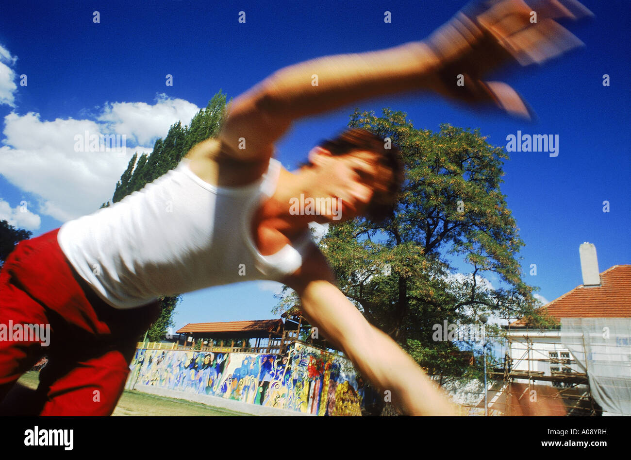 Young man bending over Stock Photo - Alamy