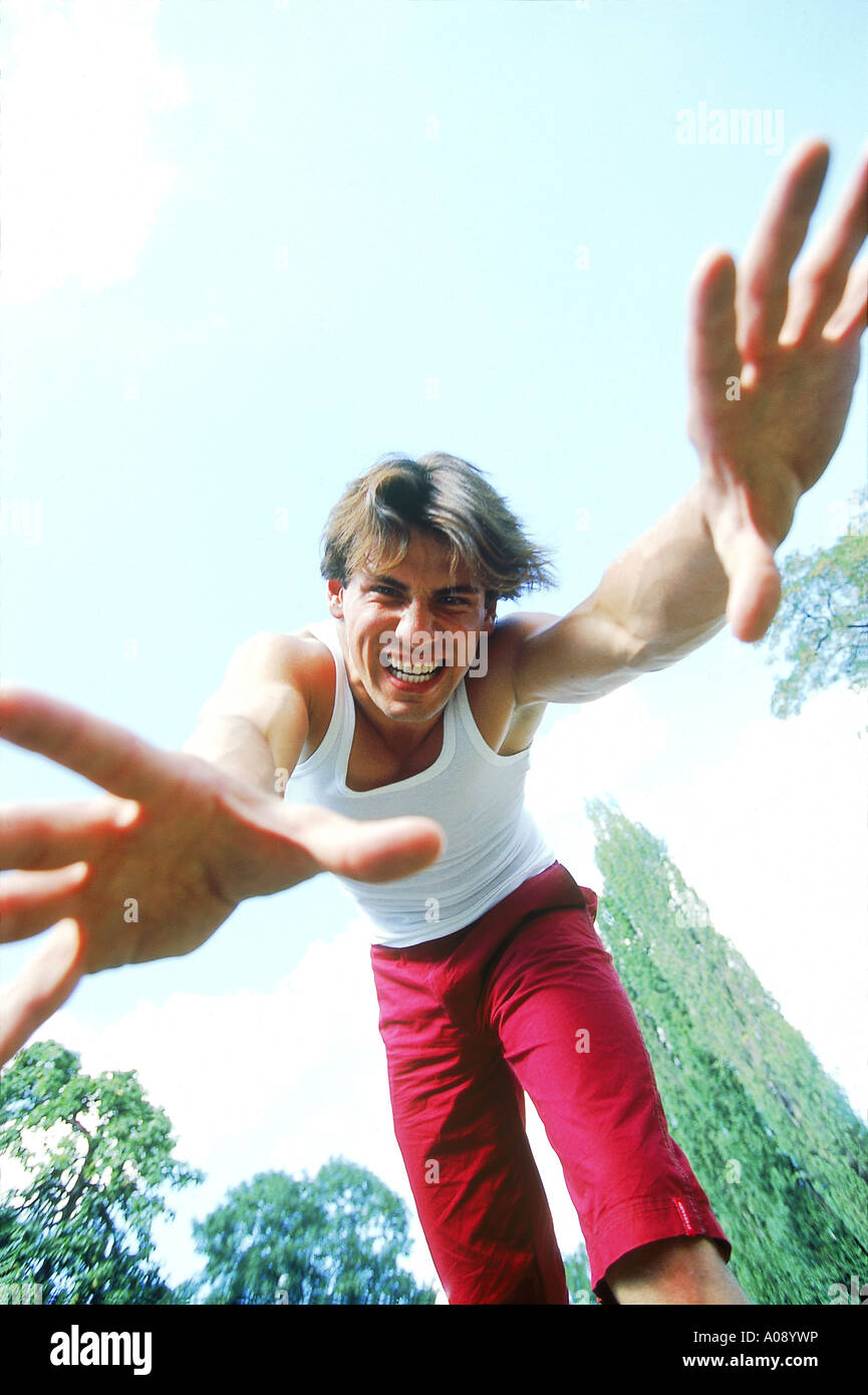 Excited Young Man Reaching Out High Resolution Stock Photography and ...